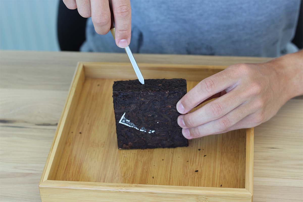 How to Break a Puerh Tea Brick – Tea Adventures